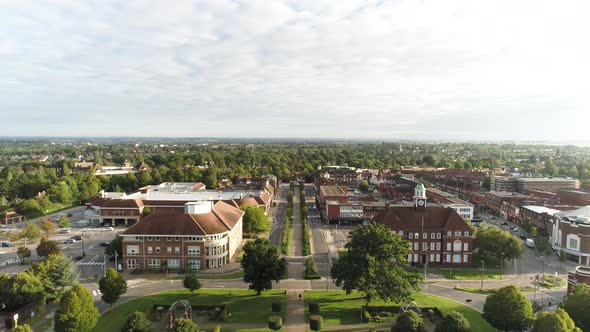 Drone Shot Showing A Wide Shot Of The Town And Green Spaces In drone-shot-showing-a-wide-shot-of-the-town-and-green-spaces-in
