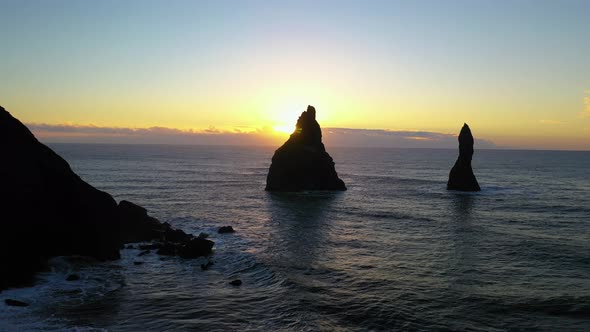 A Drone Video Flying Towards The Sunrise And The Famous Reynisdrangar a-drone-video-flying-towards-the-sunrise-and-the-famous-reynisdrangar
